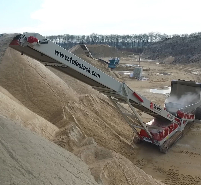 Telestack LF 520 Low Feeder stockpiling sand