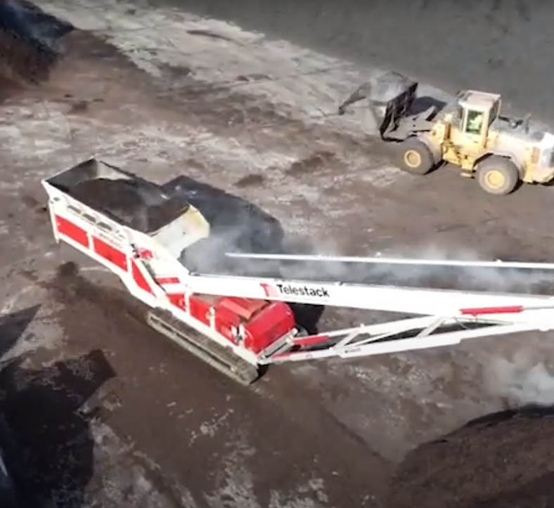 Mobile Hopper Feeder stockpiling mulch | Telestack Ltd